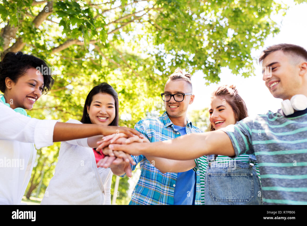Stacking hands hi-res stock photography and images - Alamy