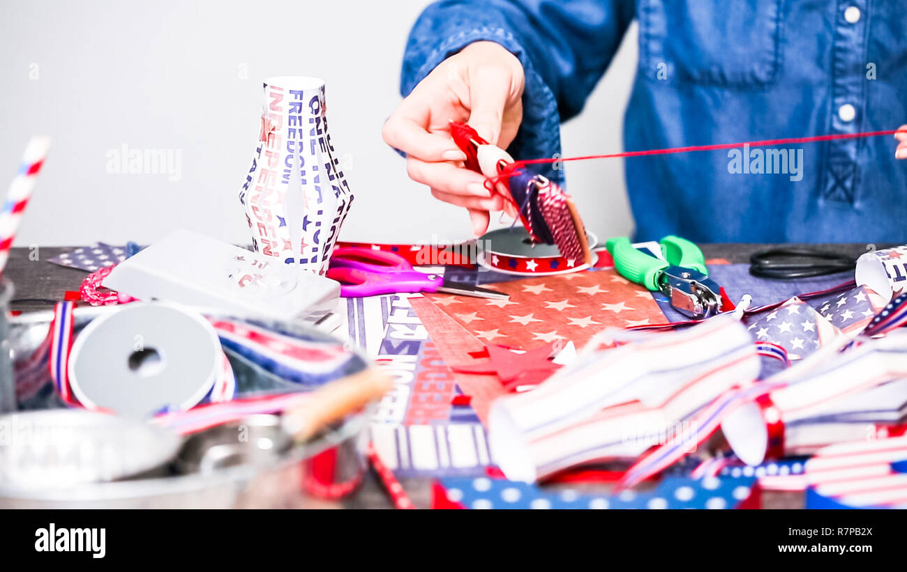 Step by step. Mother and daughter making paper firecrackers for July ...