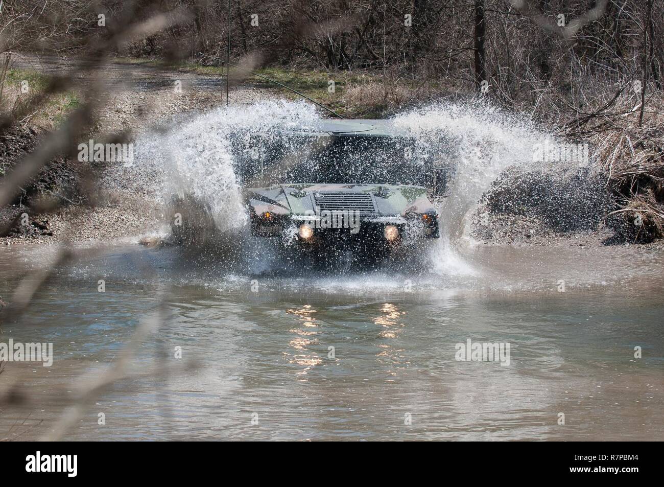 A 416th TEC Soldier fords a water obstacle during a portion of the off ...