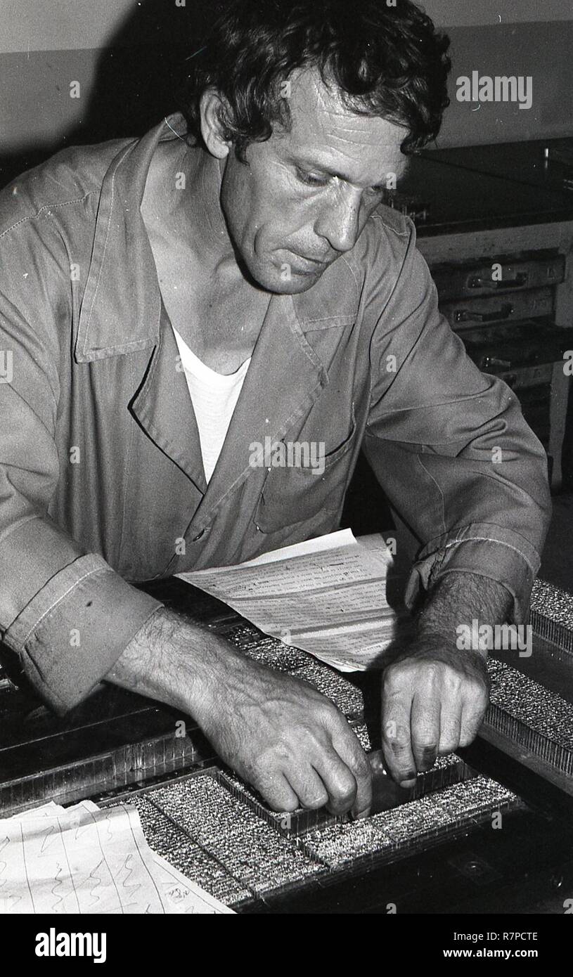 MAN LOOKING AT A FEW OBJECTS ON A MACHINE Stock Photo - Alamy
