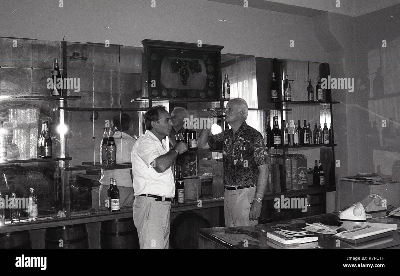 MEN IN A BUILDING; DRINKING Stock Photo - Alamy