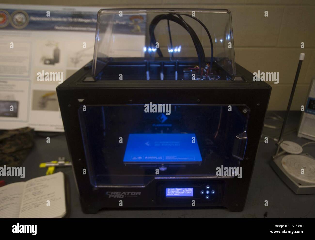Marines display a 3-D printer used to create replacement parts at the ...