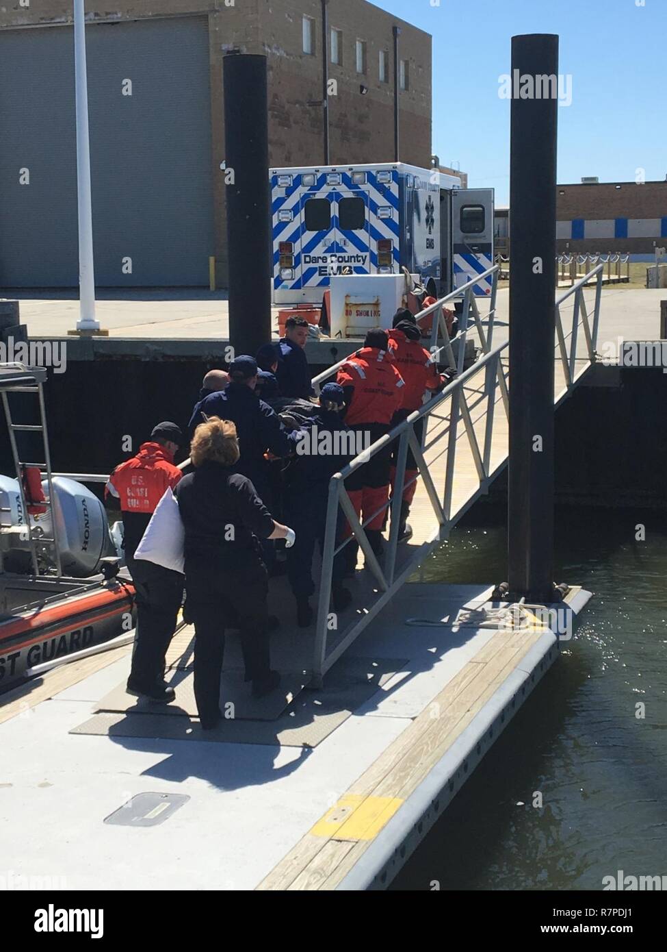 Coast Guard Station Hatteras Inlet crew members and local EMS personnel ...