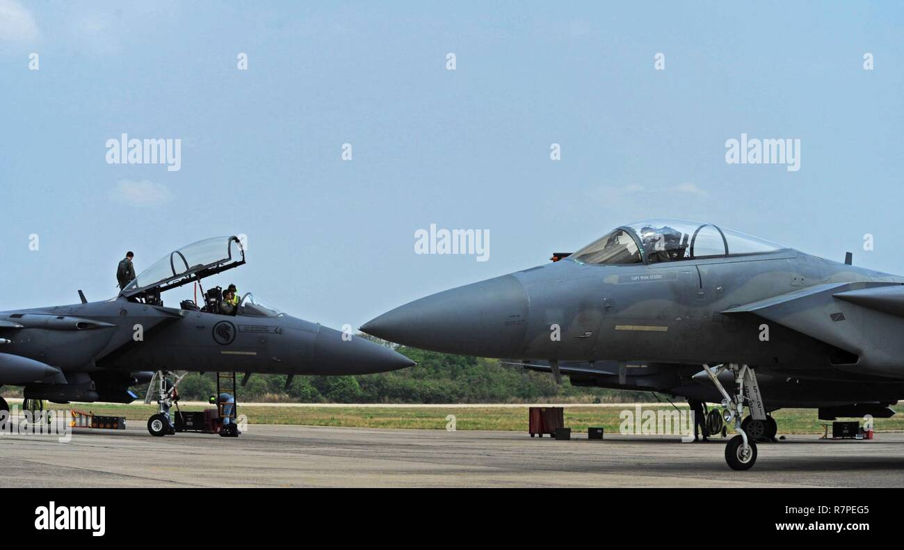 A U.S. Air Force F-15 (front) taxis past a Republic of Singapore air ...