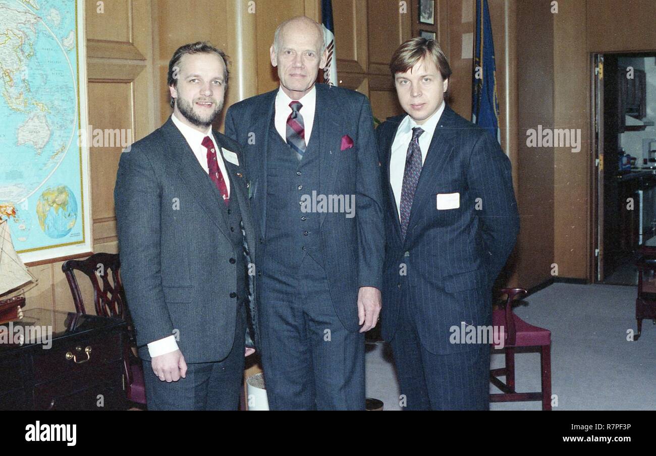 THREE MEN STANDING TOGETHER TAKING A PICTURE IN THE OFFICE Stock Photo ...