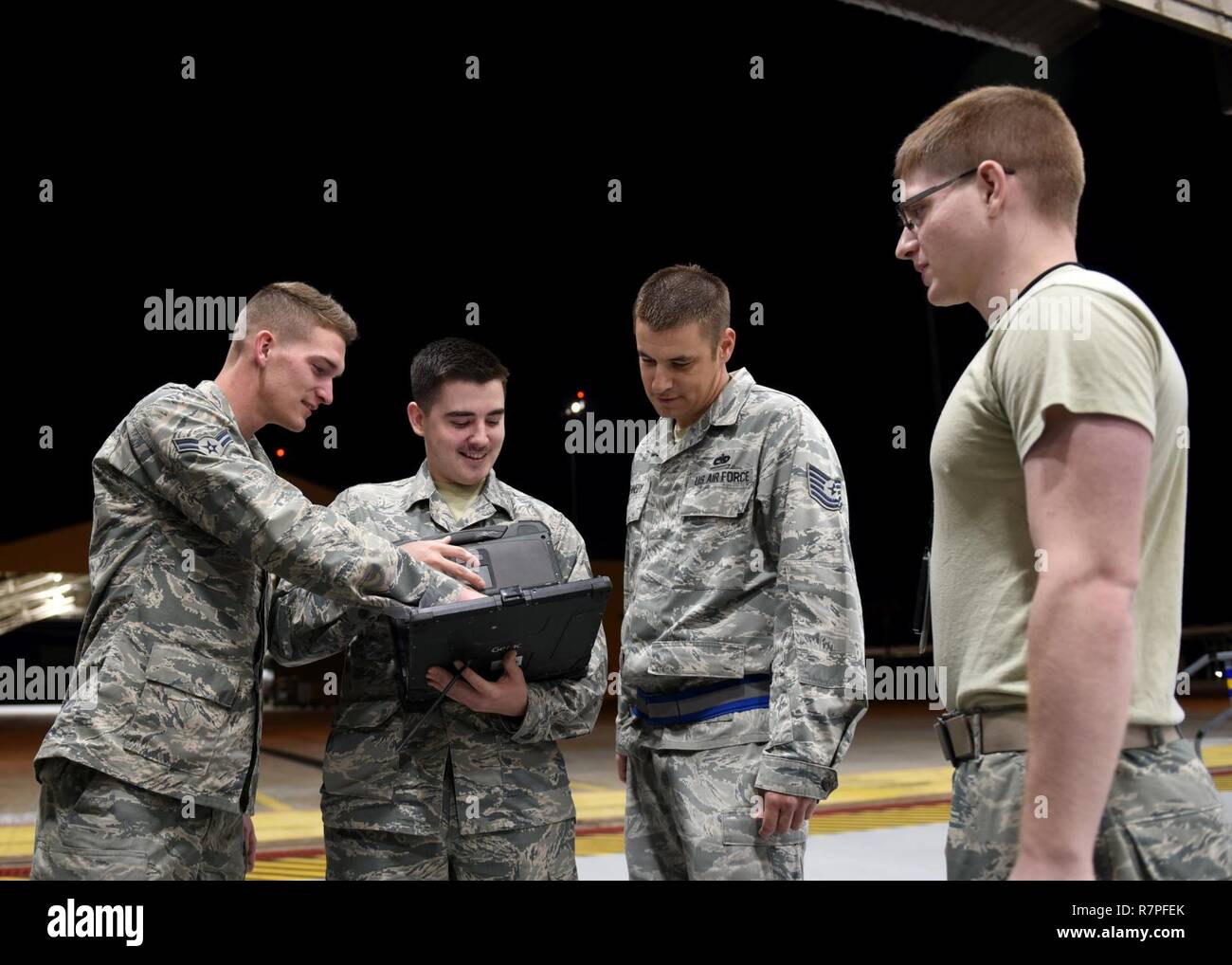U.S. Air Force Tech. Sgt. Chris Kennedy (second from right), 325th ...