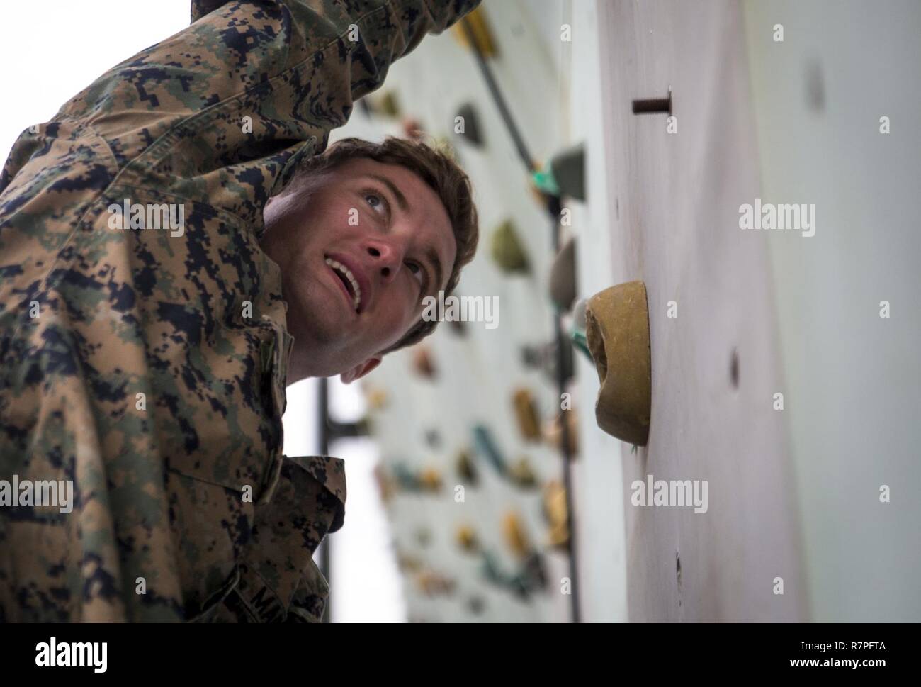 Cpl. Alex Thill climbs his way to the top of a rock wall March 24, 2017 ...