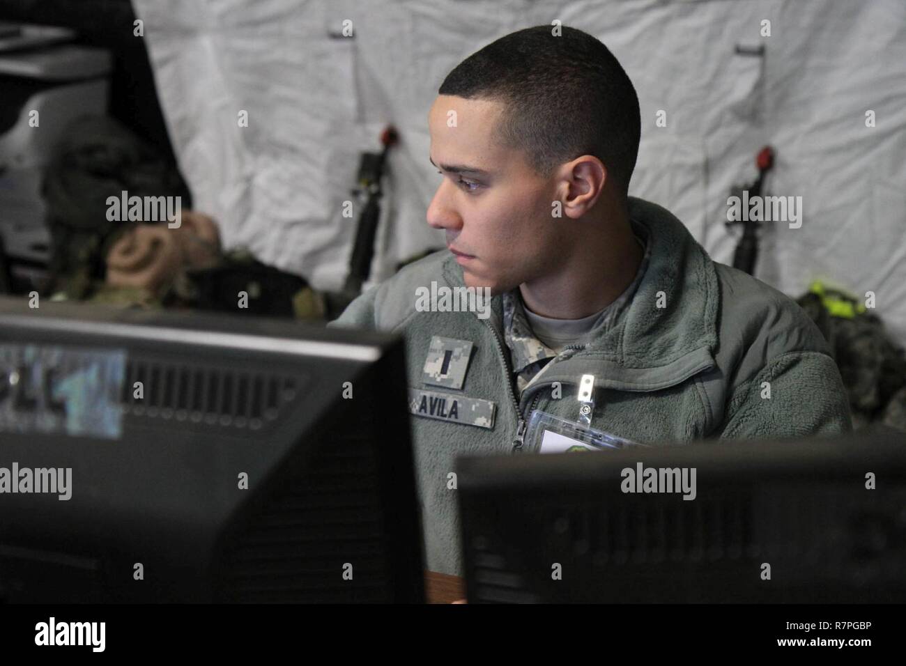 1st Lt. Louis Santiago Avila of the 724th MP Battalion tracks and ...