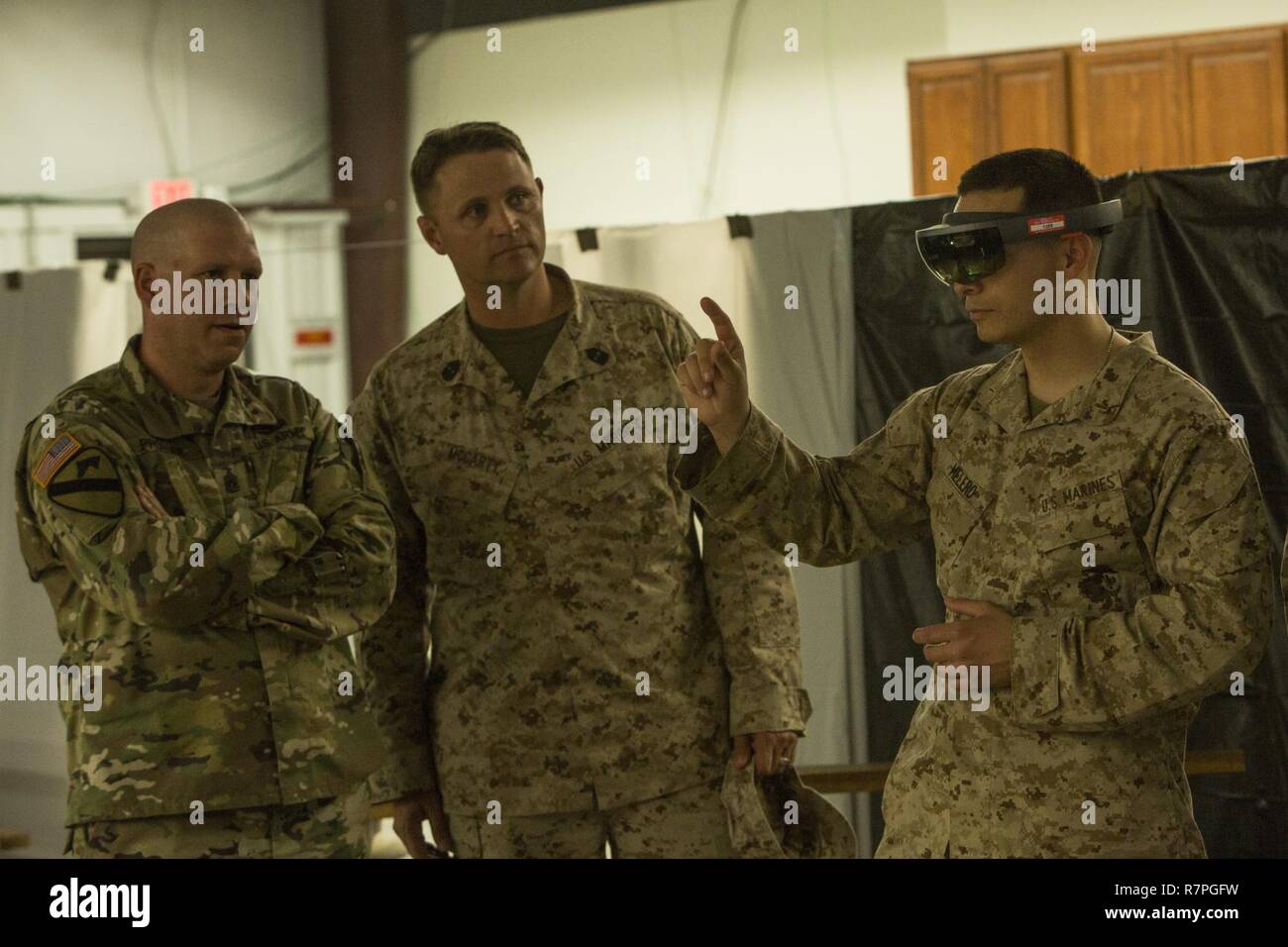 U.S. Marine Corps 2nd Lt. Julius A. Melero, right, assistant operations ...