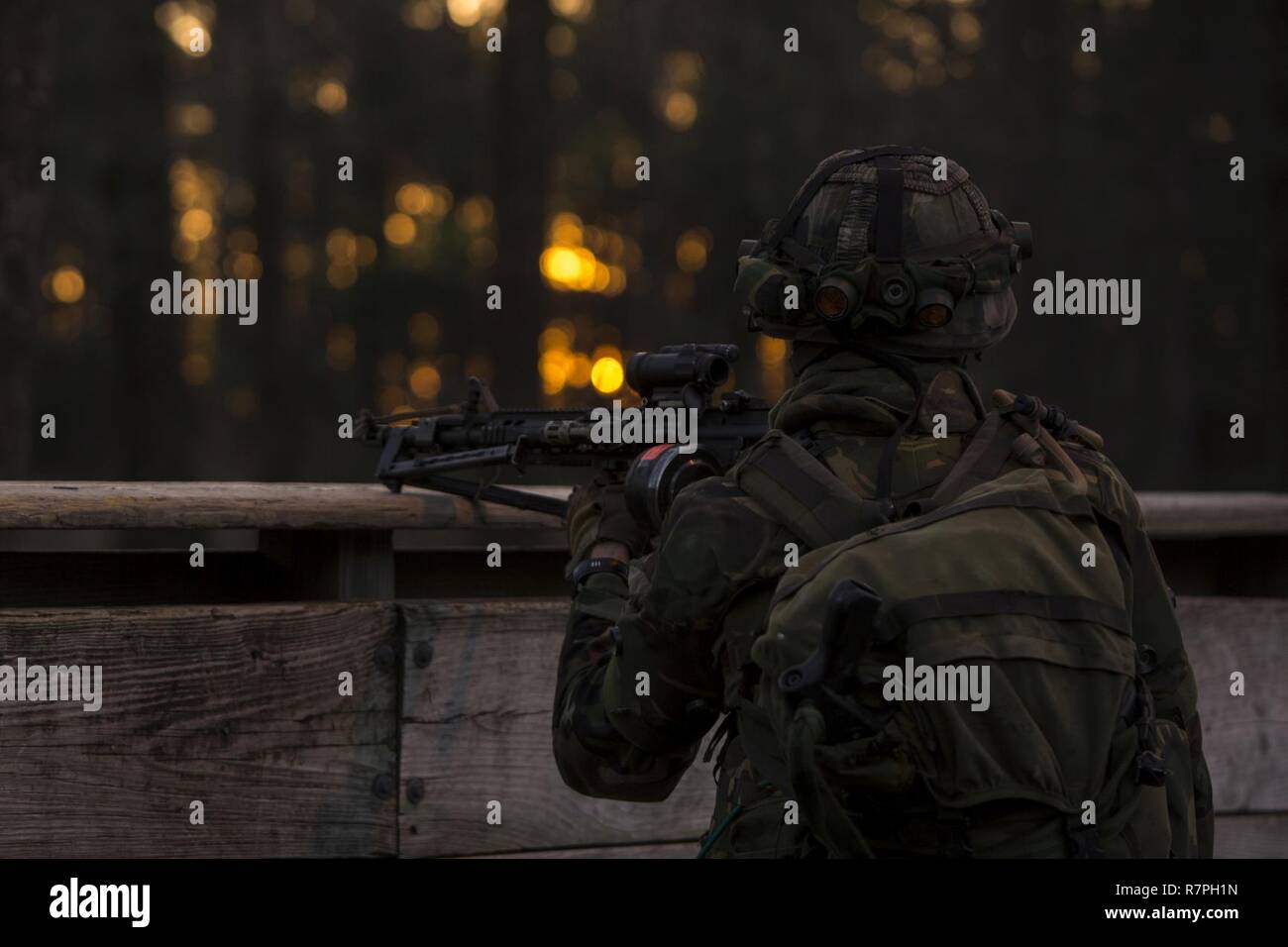 A Dutch Marine provides security with his Colt Canadian C7A3 carbine ...