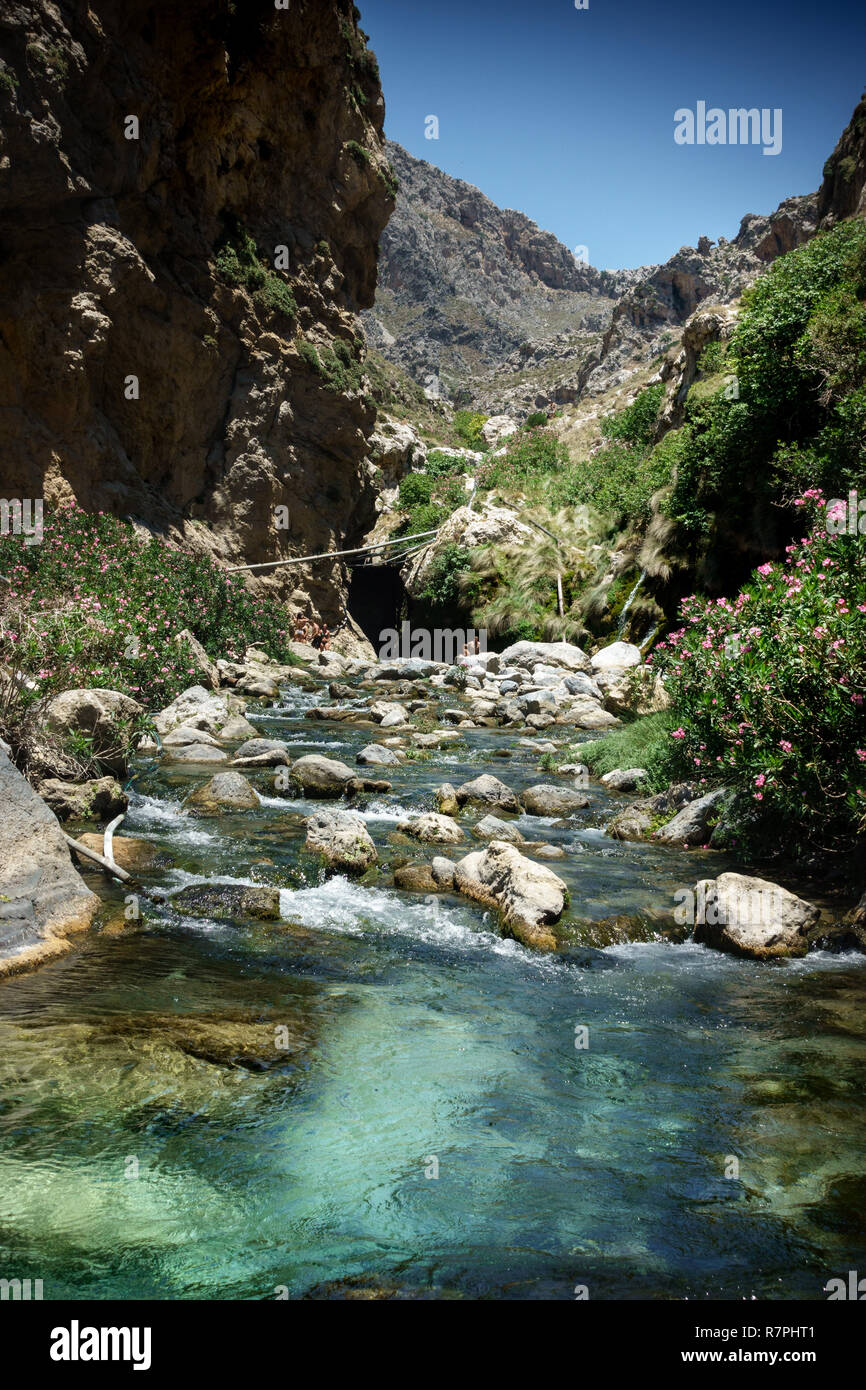 Stream flowing through rocks Stock Photo - Alamy