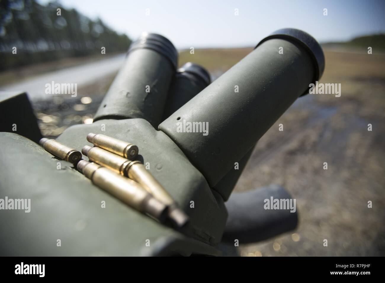 M240B machine gun shells sit atop a four-barrel smoke grenade launcher ...