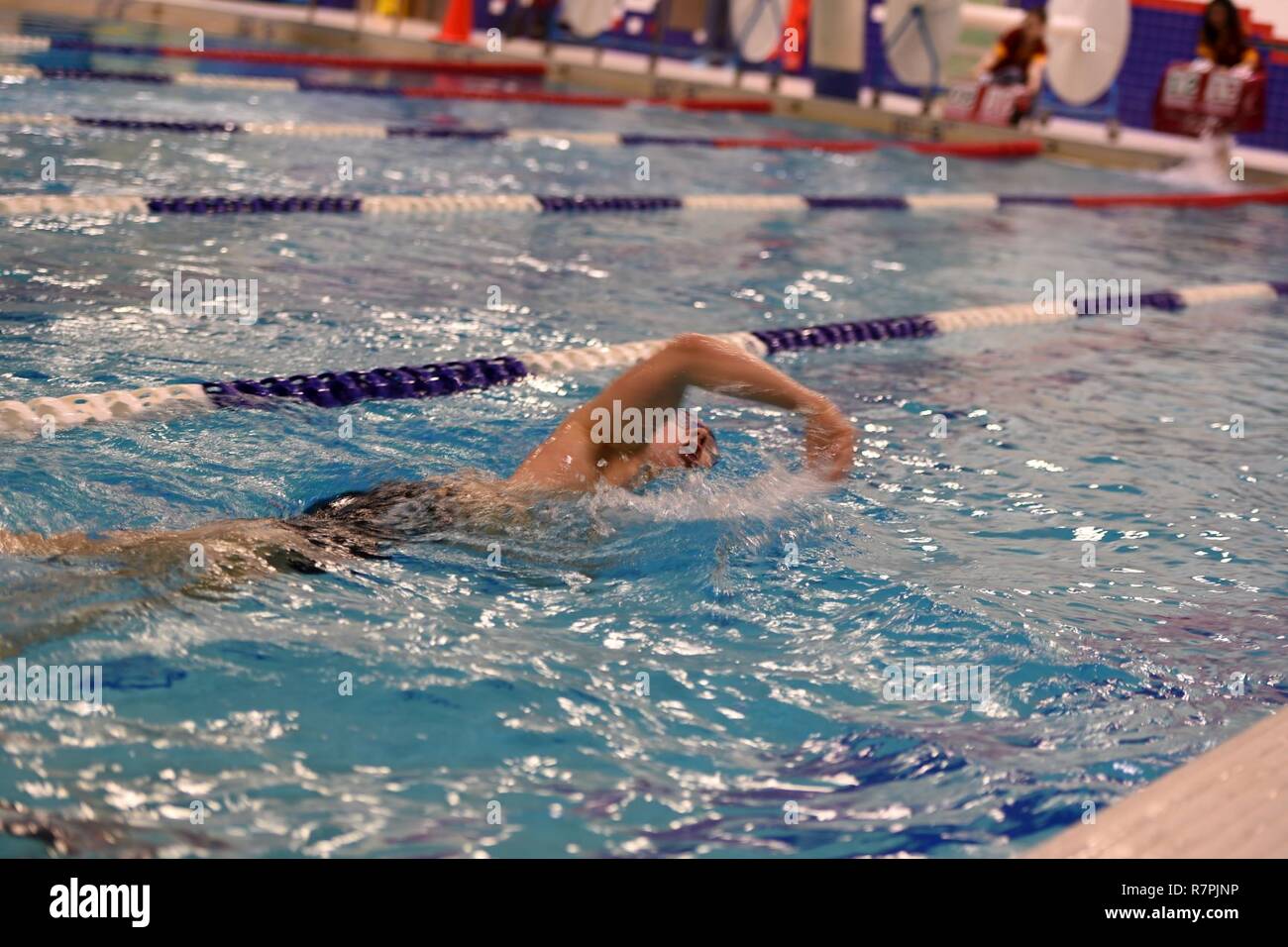 A Junior ROTC Indoor Triathlon swimmer from Chugiak High School swims ...