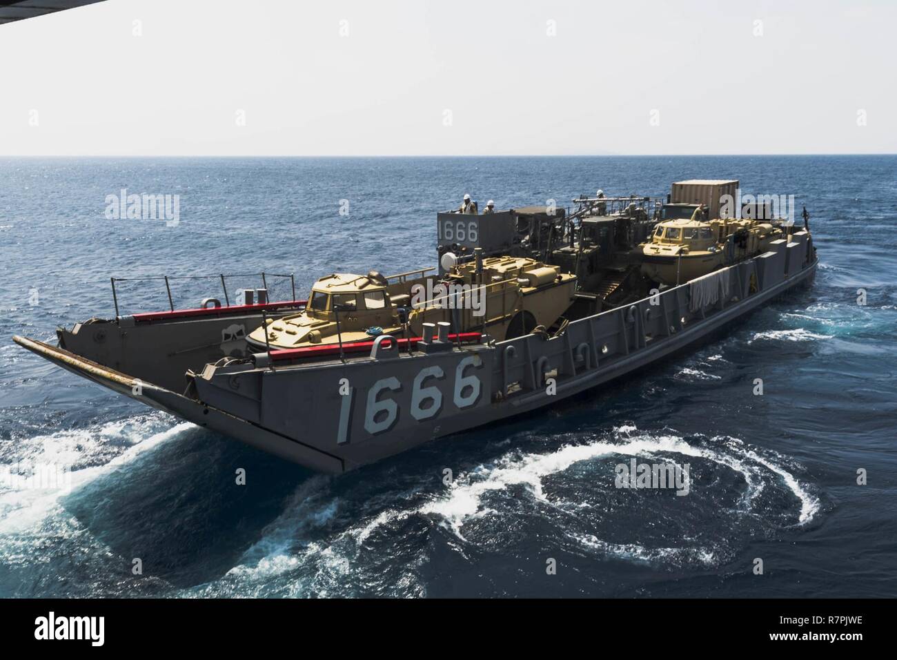 KINBU BAY (March 27, 2017) Landing craft utility 1666, assigned to ...
