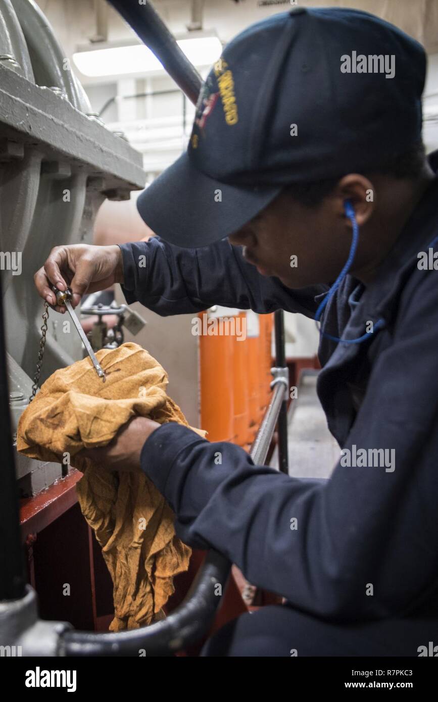 PHILIPPINE SEA (March 26, 2017) Machinist's Mate Fireman Michael Okray ...