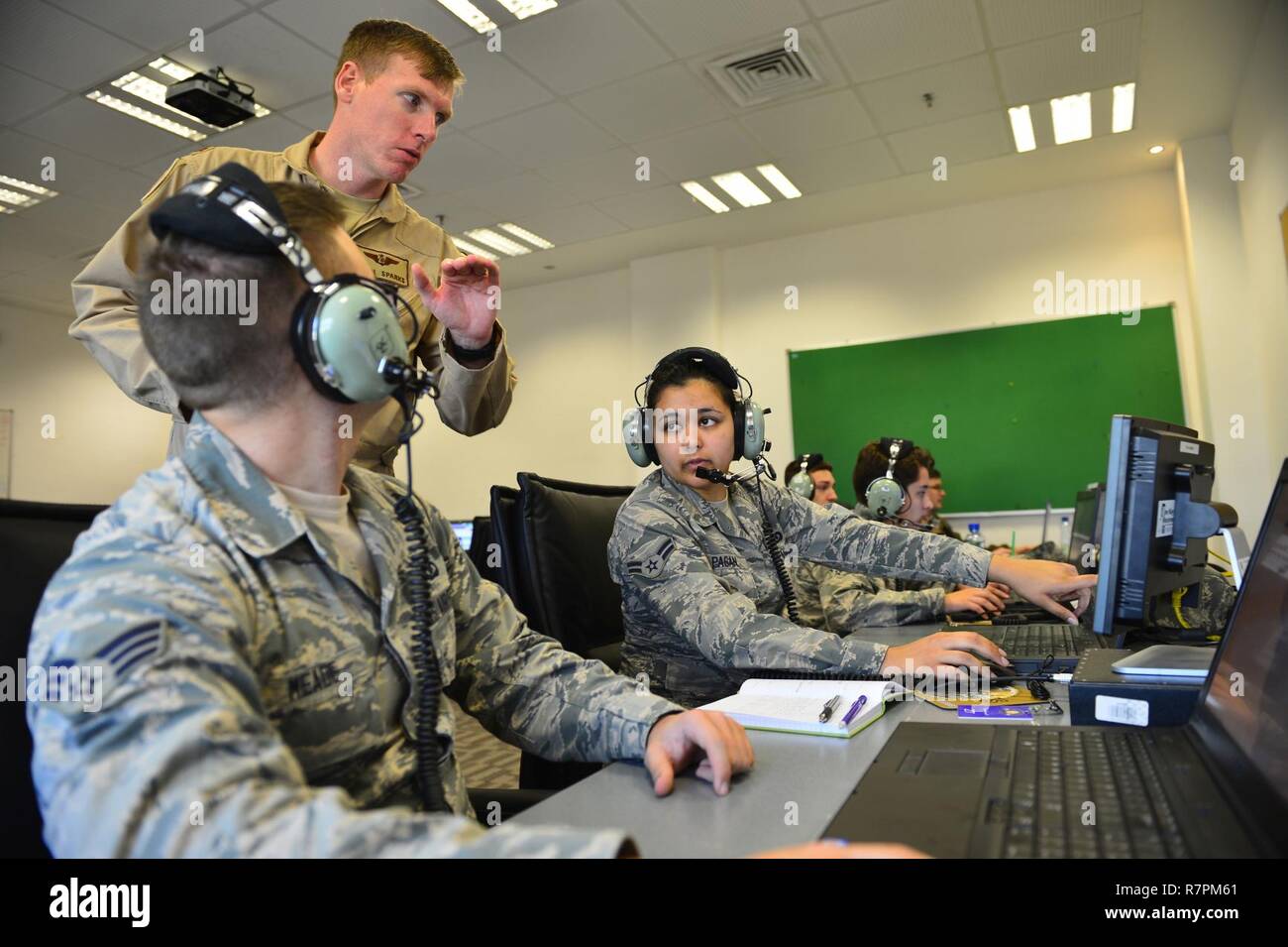 Senior Airman Jon Meade (left) and Airman 1st Class Taylor Pagan (right ...