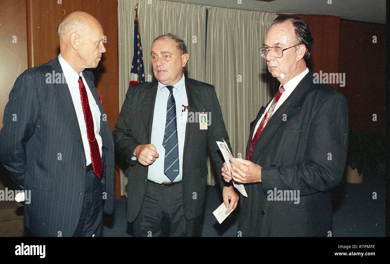 THREE MEN ARE HAVING A CONVERSATION WITH EACH OTHER Stock Photo - Alamy