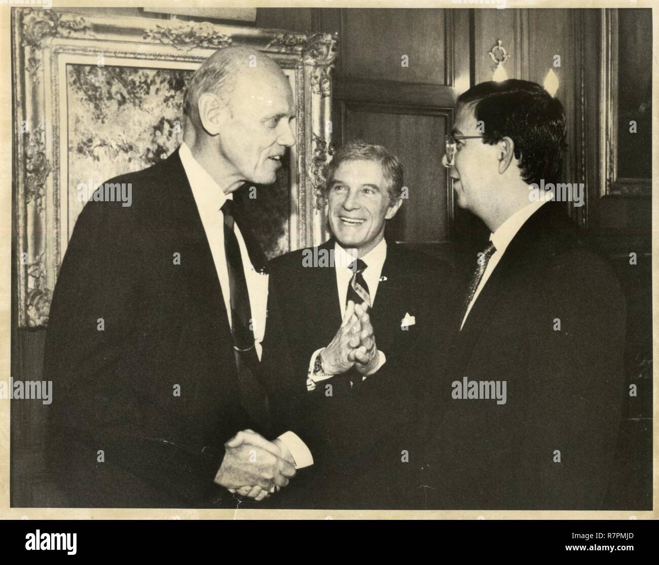 THREE MEN ARE HAVING A CONVERSATION IN THE OFFICE Stock Photo - Alamy