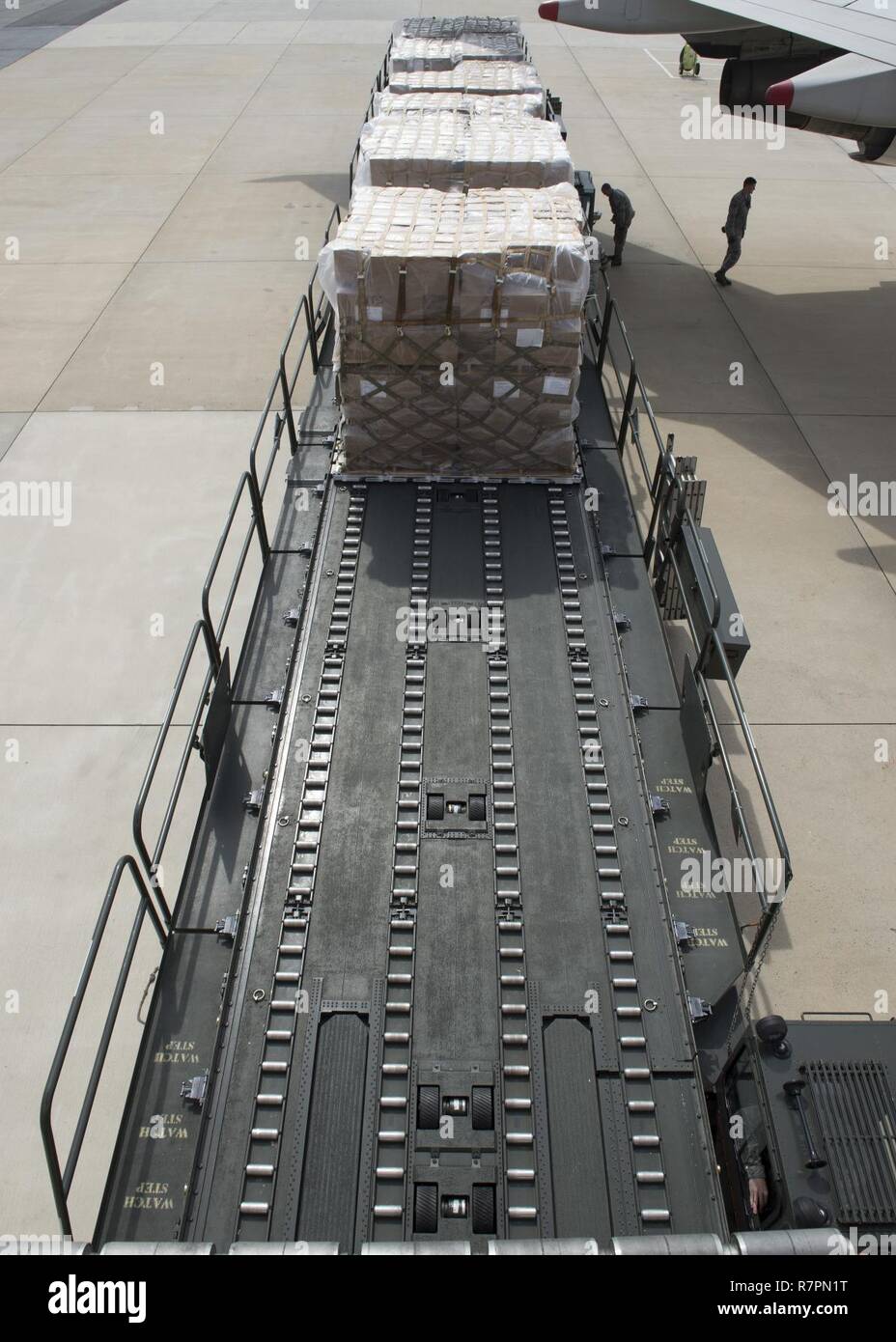 Airmen from the 436th Aerial Port Squadron load cargo onto a Kalitta ...