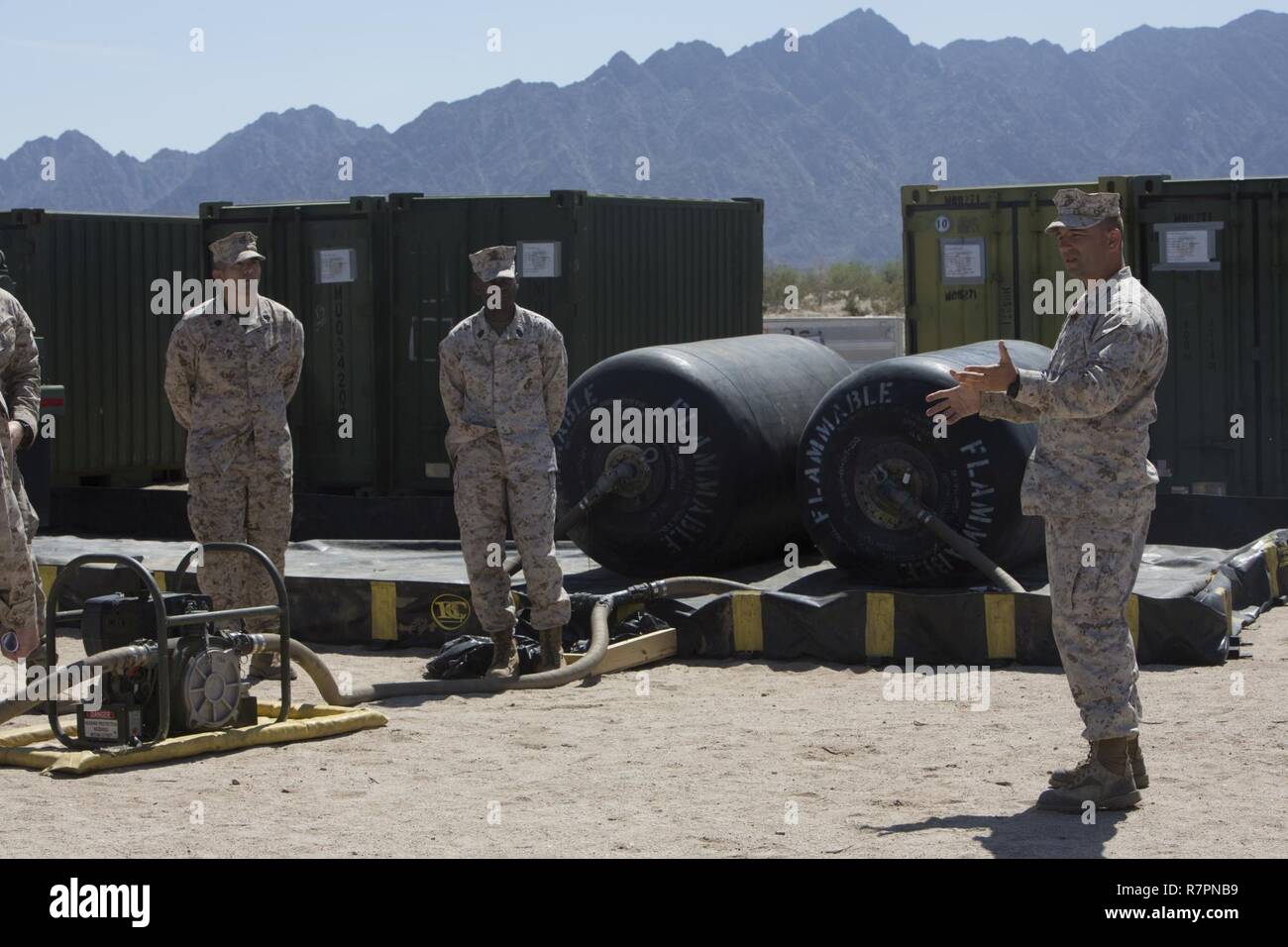 U.S. Marine Corps Staff Sgt. Jason Pimental, forward arming refueling ...