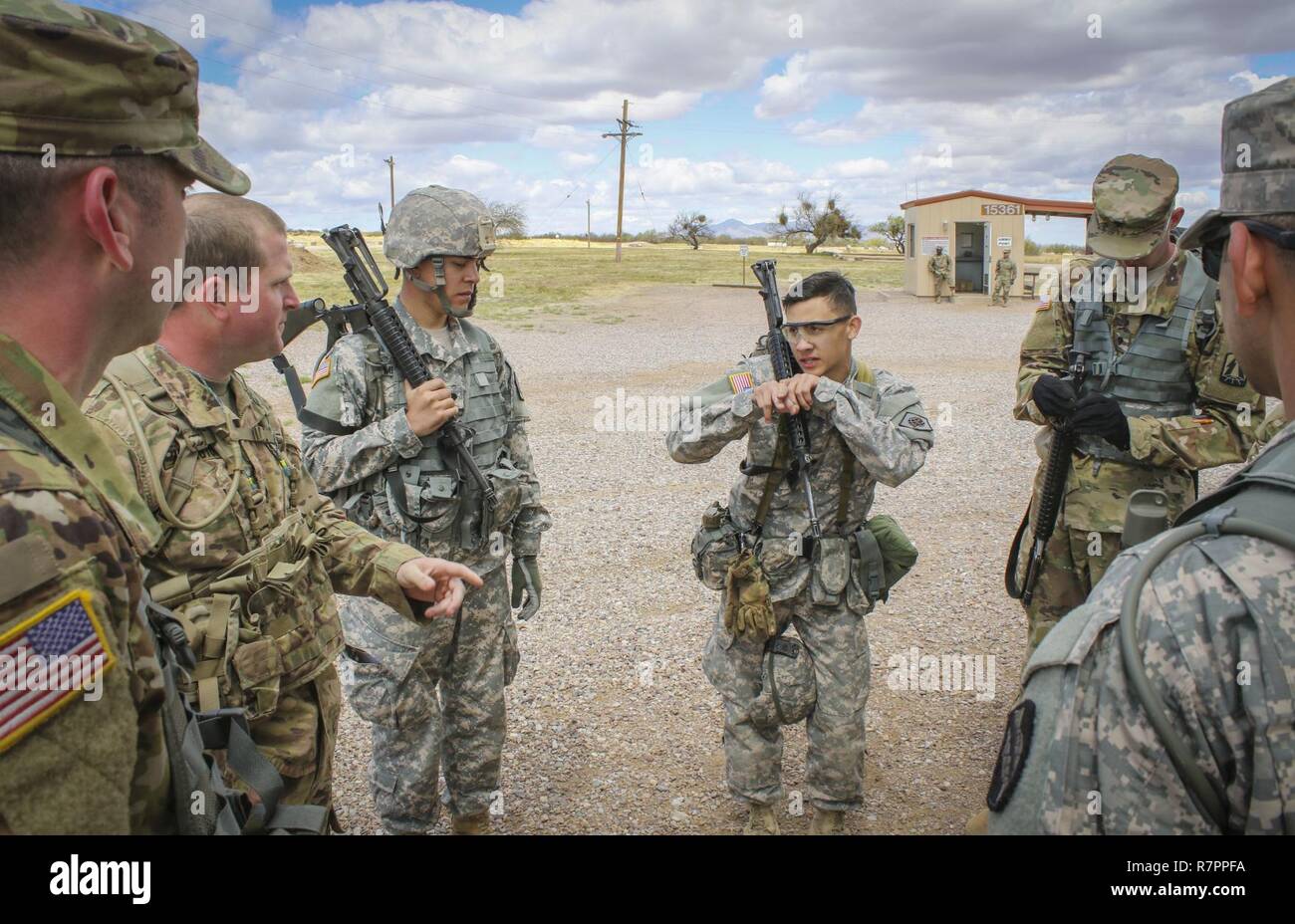 Army Reserve Spc. Julian Ditona (center), a multi-channel transmission ...