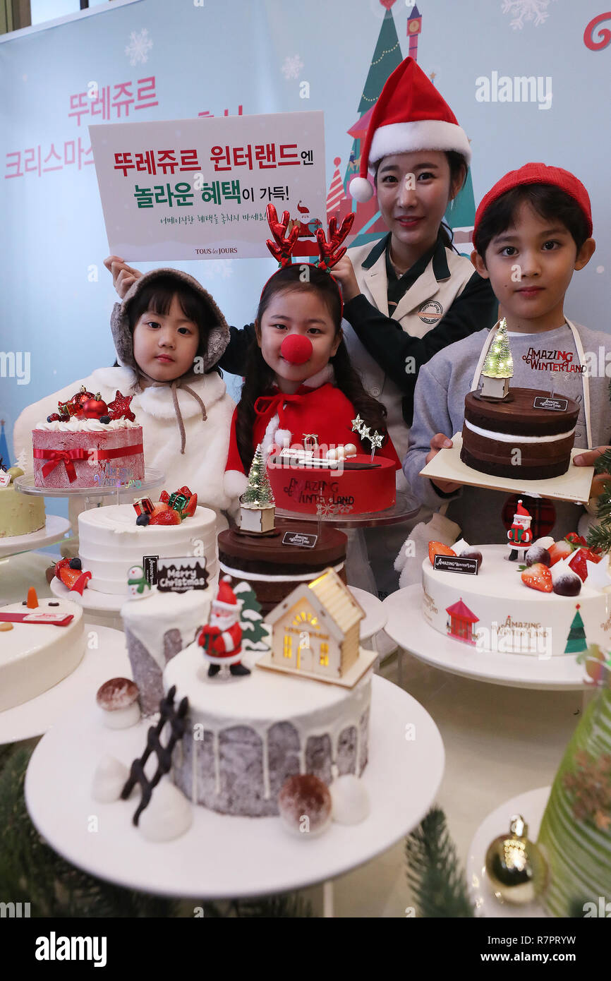 11th Dec, 2018. Christmas cakes Models show off Christmas cakes at a ...