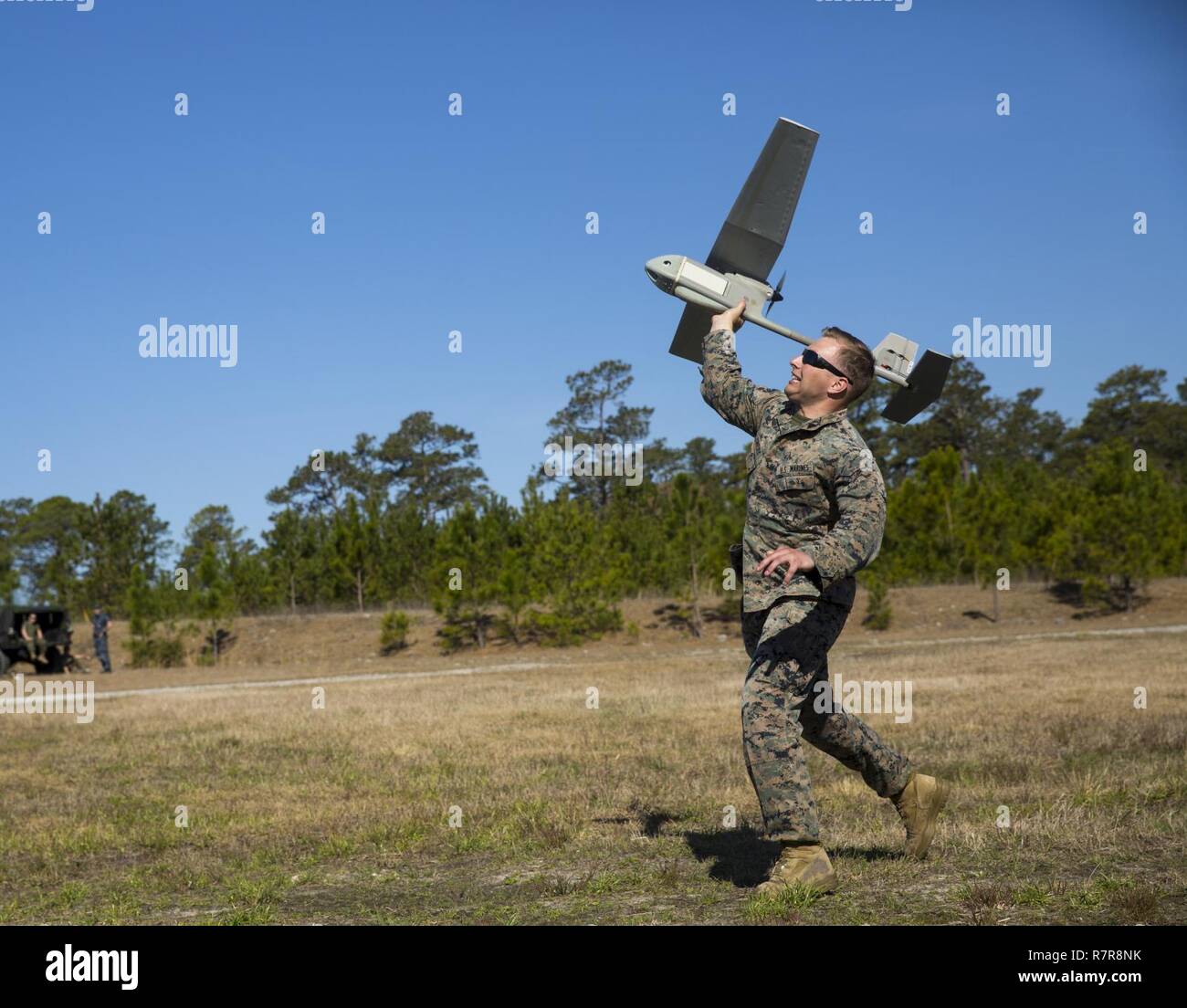 Sgt. Dillon Emery launches a Raven small unmanned aircraft system at ...