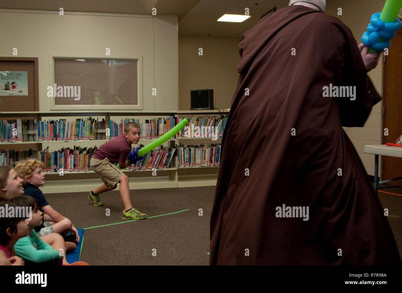 SCHOFIELD BARRACKS — Caden Laakmann, 10, duels with “Jedi Jim” during ...