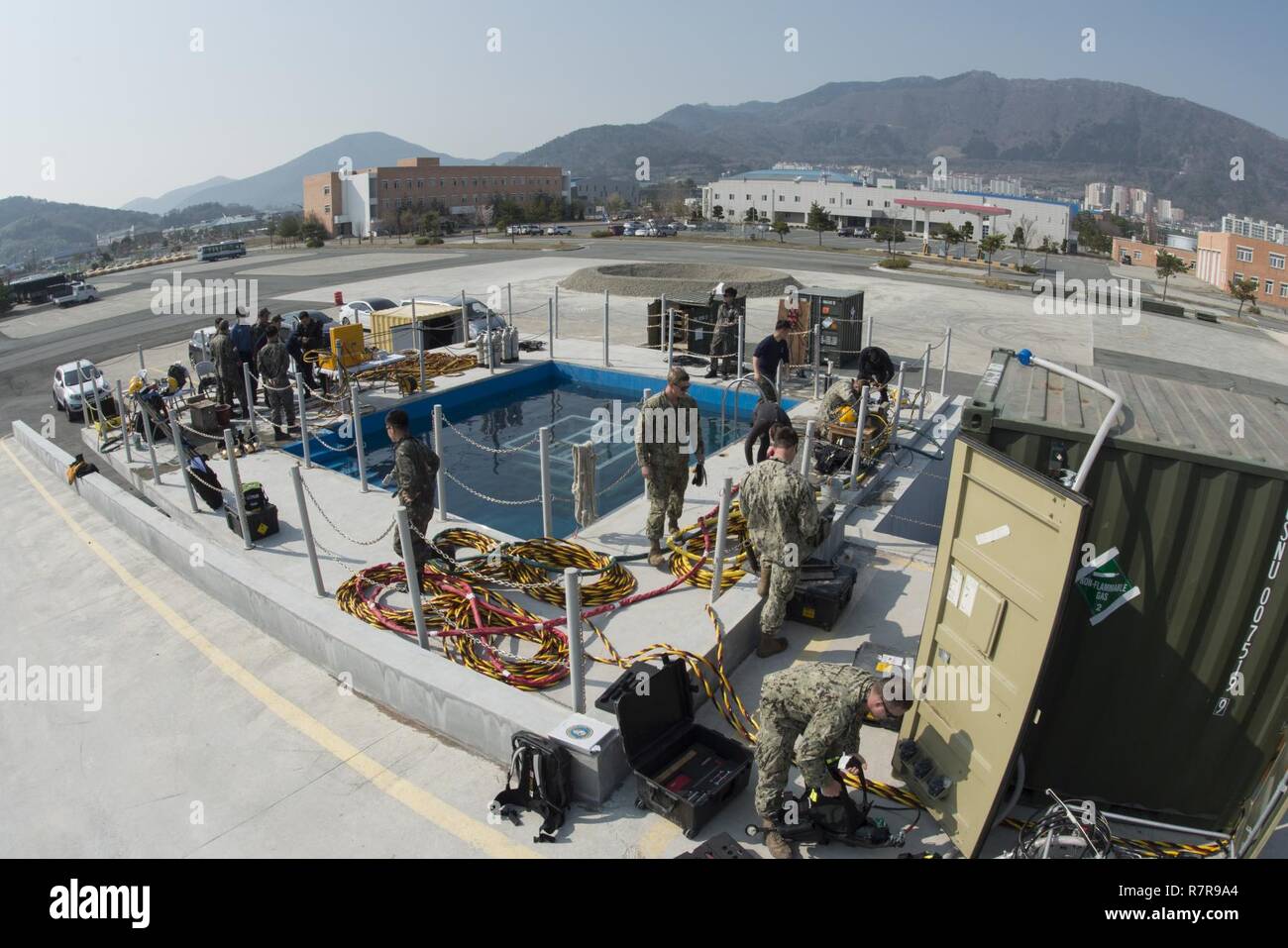 Sailors from the U.S. Navy's Underwater Construction Team (UCT) 2 set ...