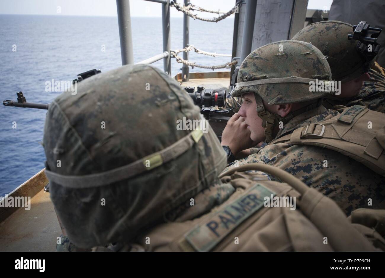PHILIPPINE SEA (March 29, 2017) Lance Cpl. Darien Peters, middle, from ...