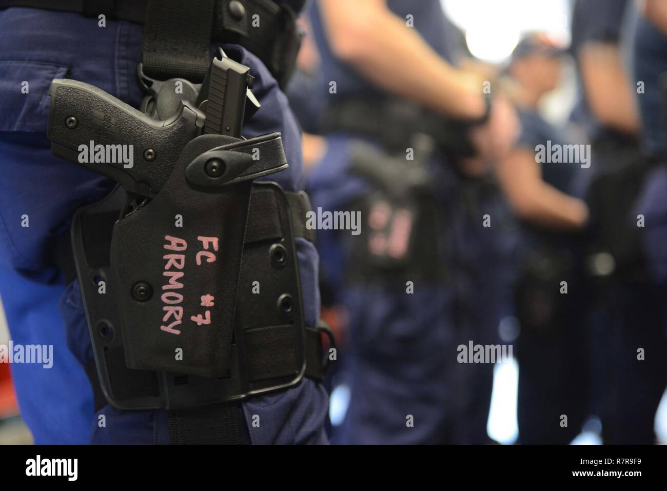 A Sig Sauer P229R DAK pistol is shown prior to being used for a ...
