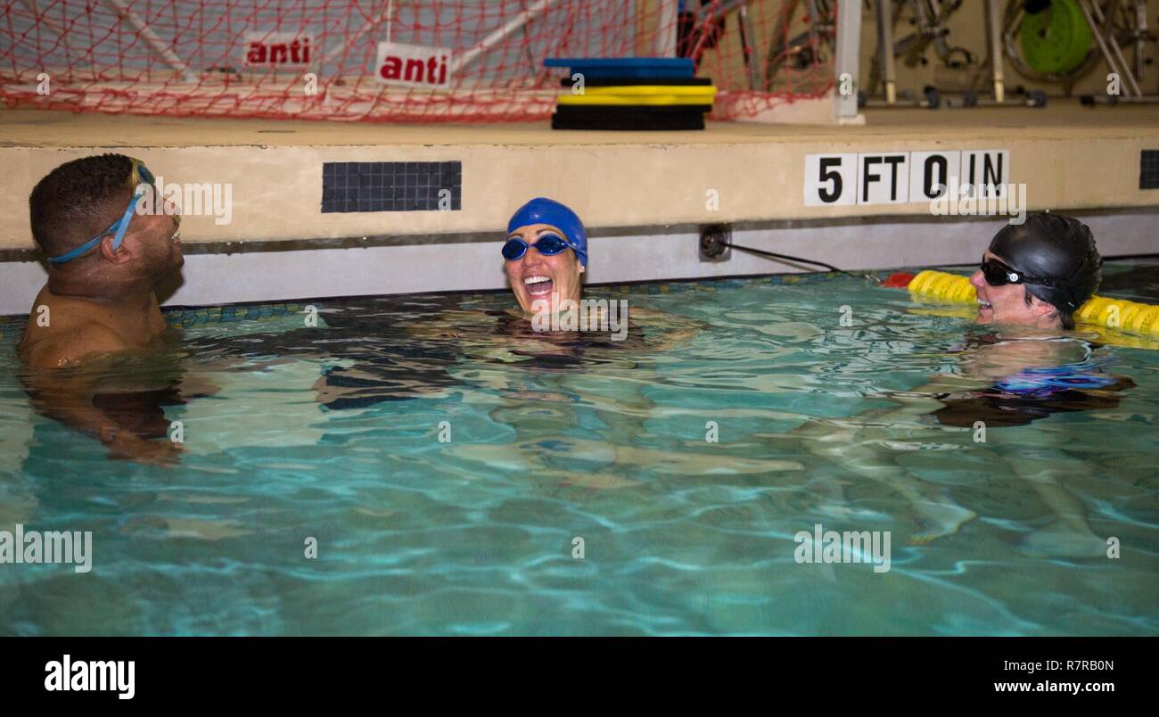 U.S. Army veterans Jodie Lemons, Ryan Major, and Nichole Pingel, train ...