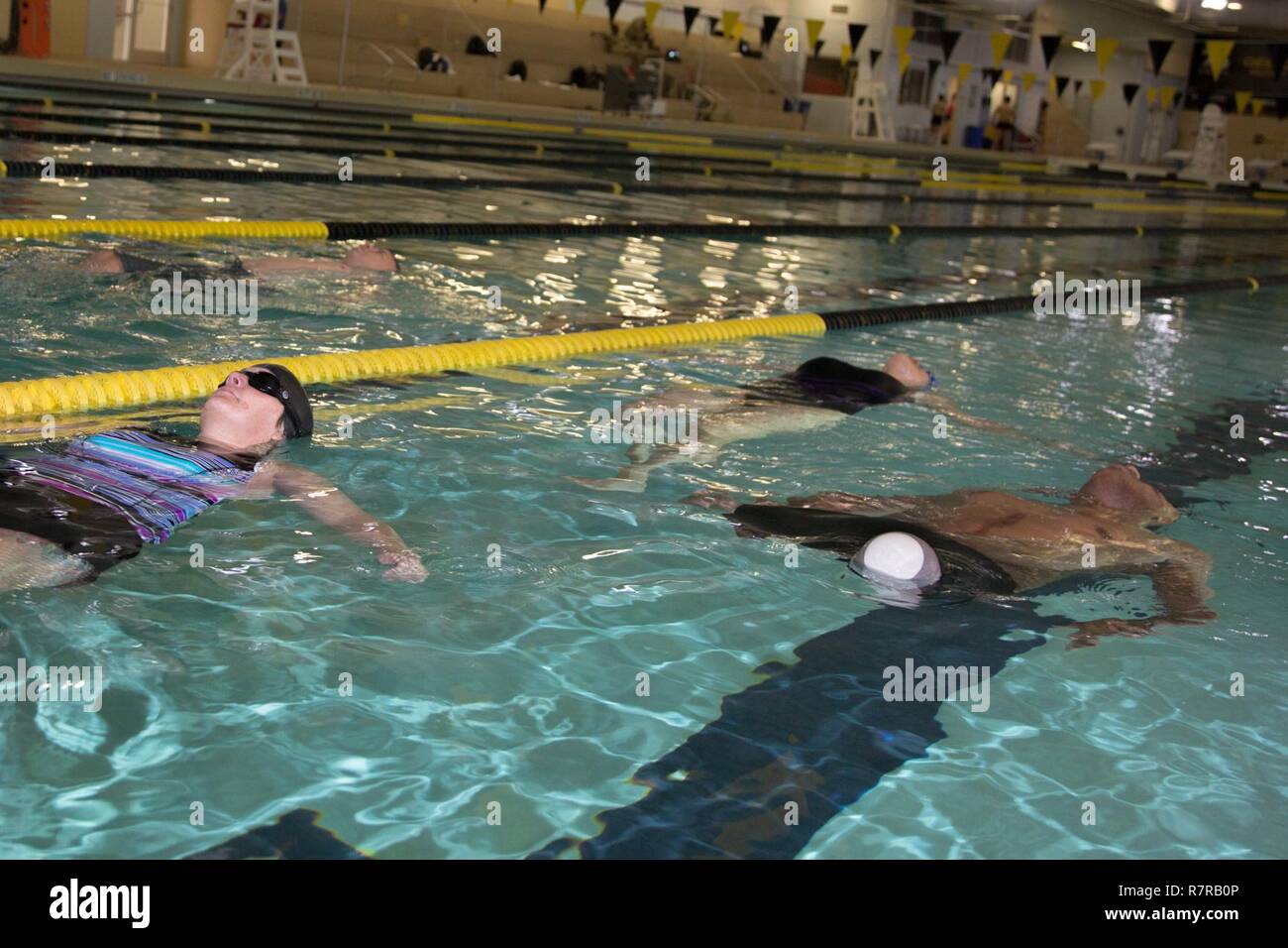 U.S. Army veterans Jodie Lemons, Ryan Major, and Nichole Pingel, train ...