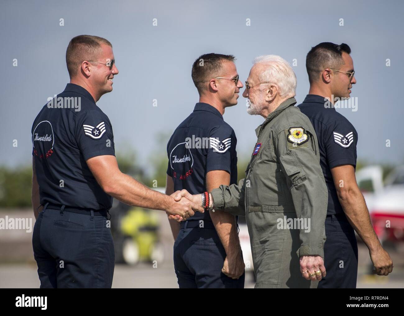 Retired Air Force Col. and astronaut Buzz Aldrin shakes hands with ...