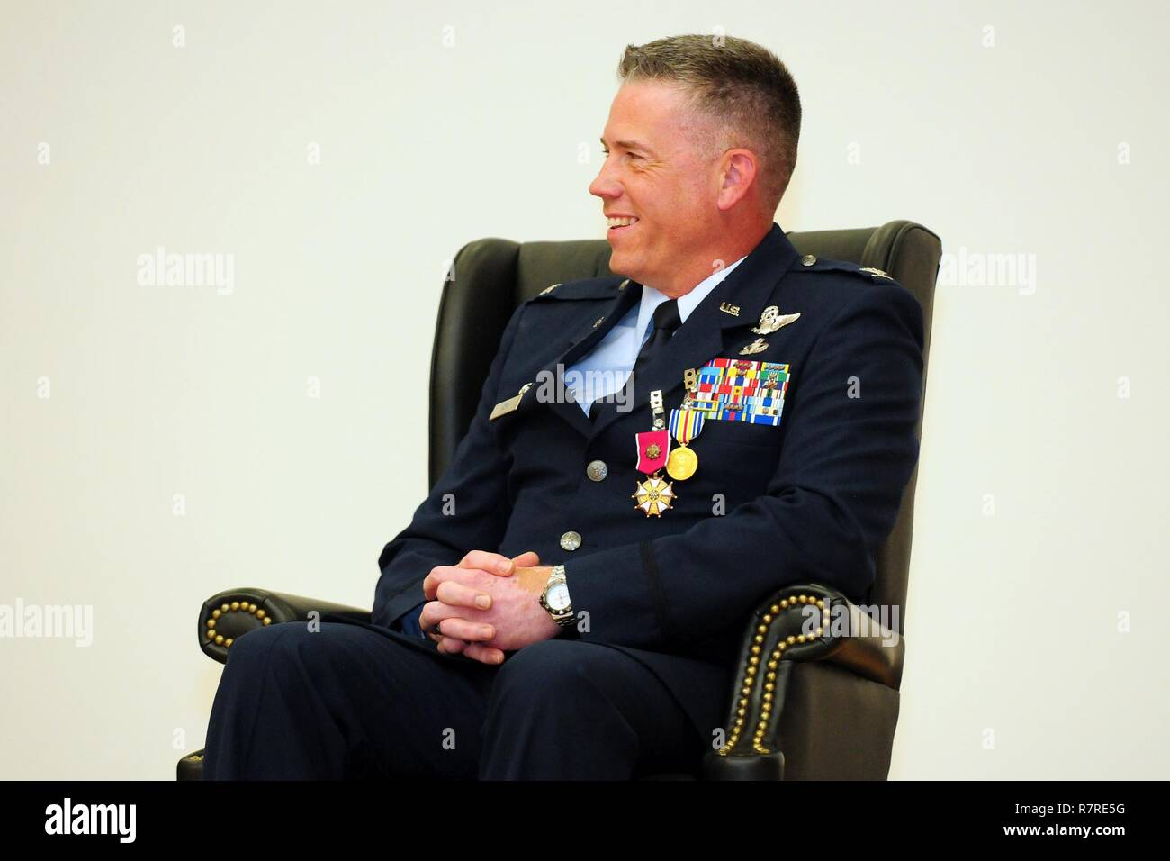 Col. Jeremy Horn, outgoing commander of the Washington Air National Guard's 194th Wing, enjoys a ...