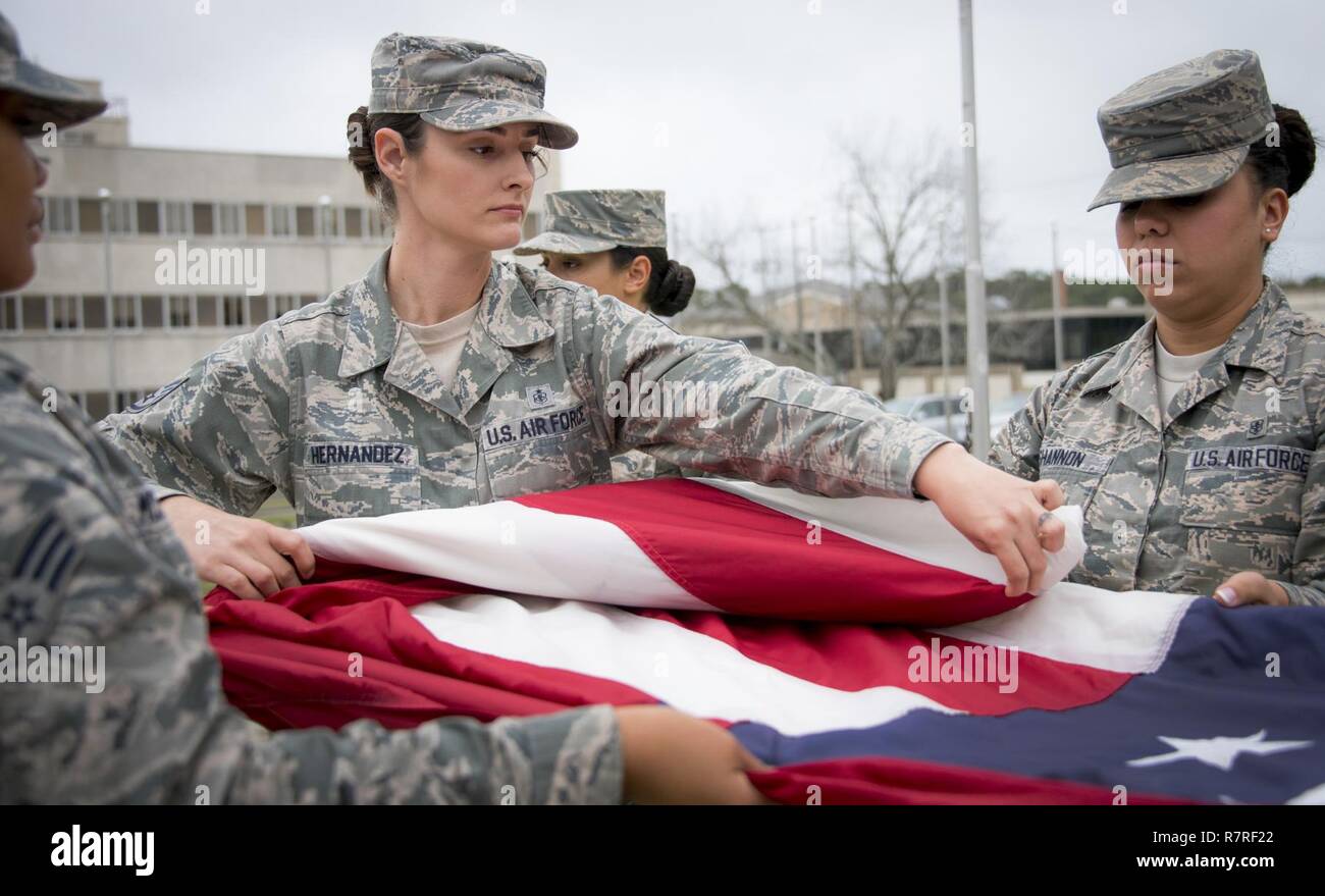 Staff Sgt. Stephanie Hernandez, 96th Medical Group, folds the American ...