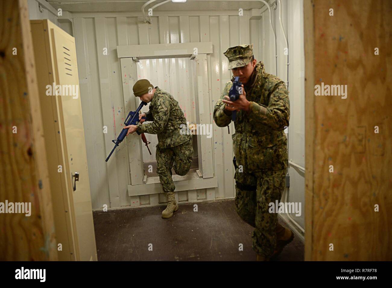 Coast Guard Reserve Port Security Unit 301 boarding team members clear ...