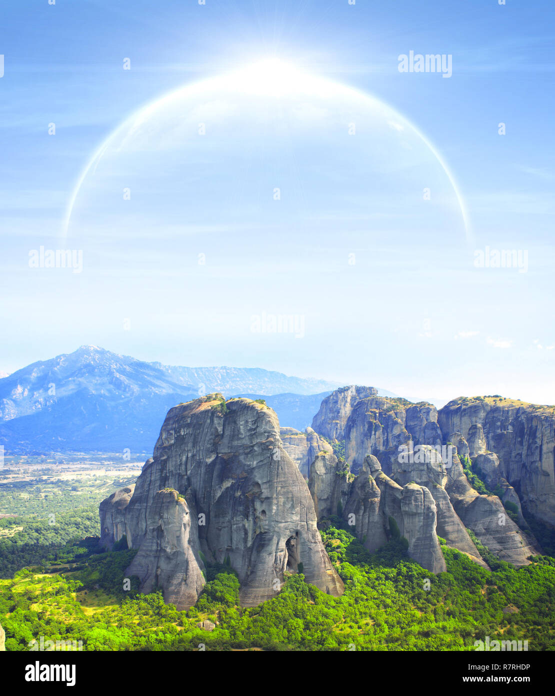 Fantastic landscape with planet, mountains and jingle Stock Photo - Alamy