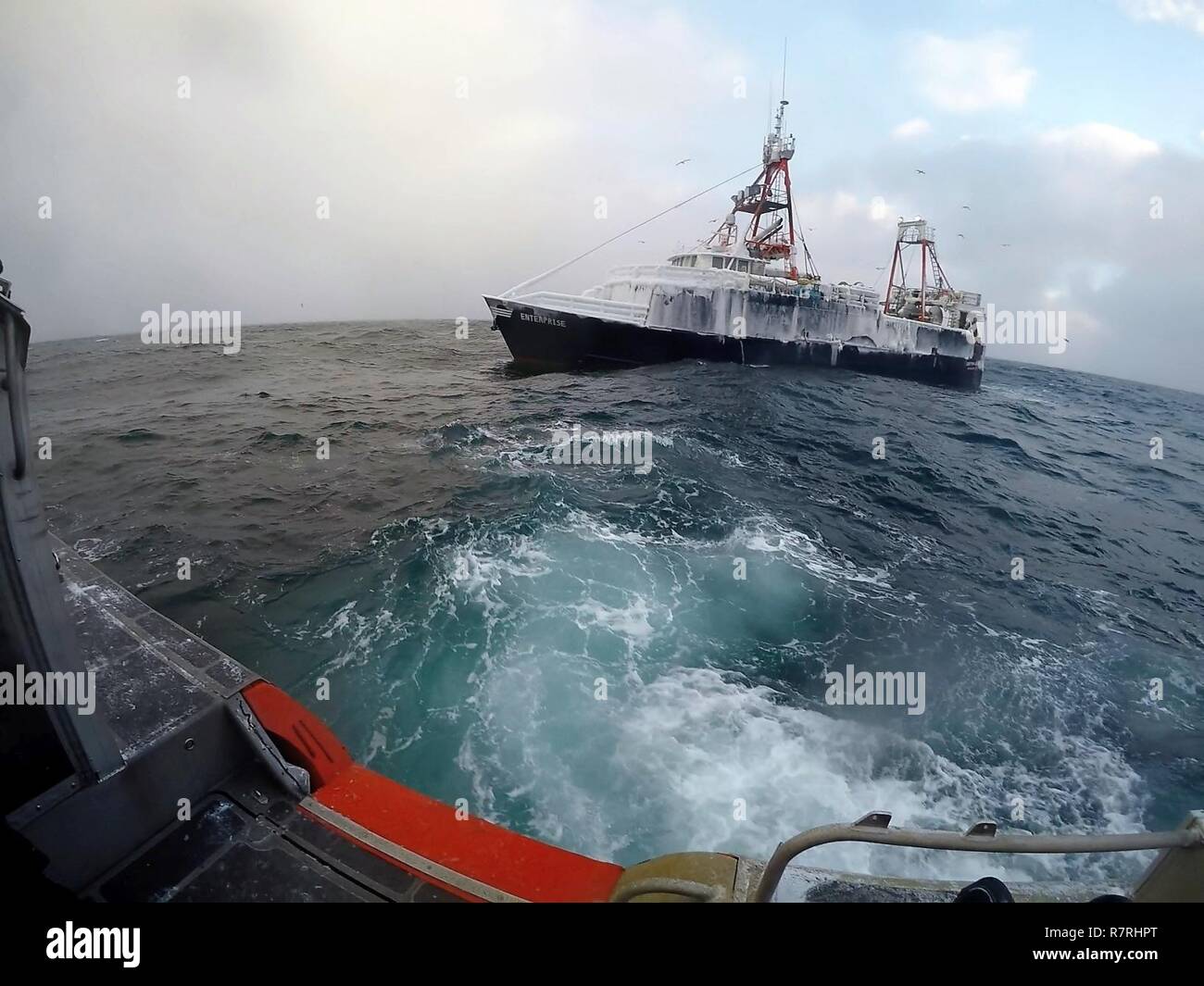 A Coast Guard Cutter Bertholf (WMSL-750) crew, prepares to board a ...