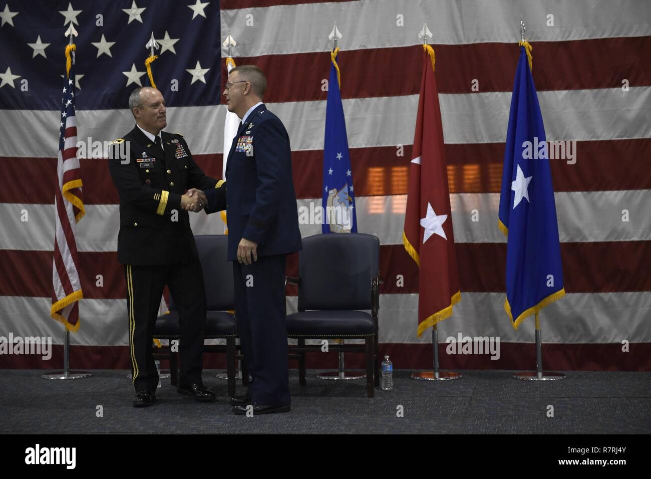 U.S. Army Maj. Gen. Greg Lusk (left), the Adjutant General of North ...