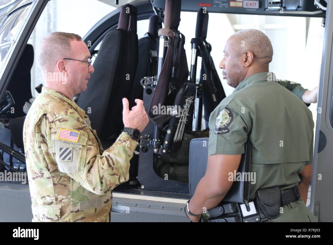 Chief Warrant Officer Bart Carter tells a wildlife and fisheries agent ...