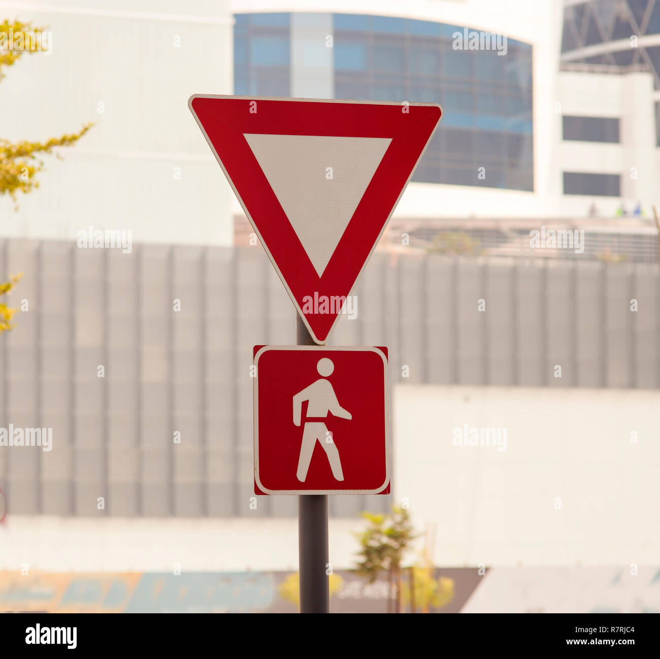 give way traffic sign in the city Stock Photo - Alamy