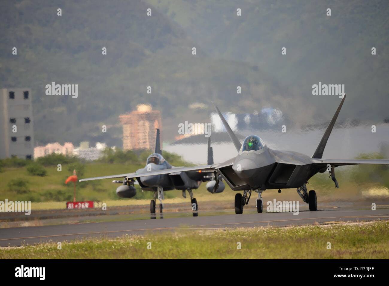 An F-22 Raptor from the 154th Wing, Hawaii Air National Guard and an F ...