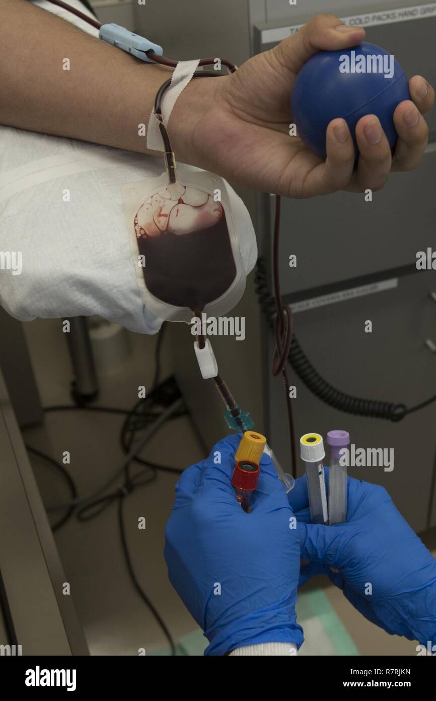 A technician draws blood April 3 at the Armed Services Blood Bank ...