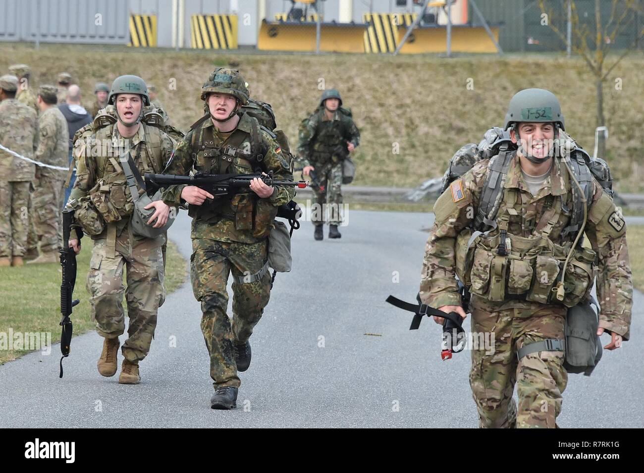 Soldiers from various nations conduct a 12 mile ruck march during the U ...