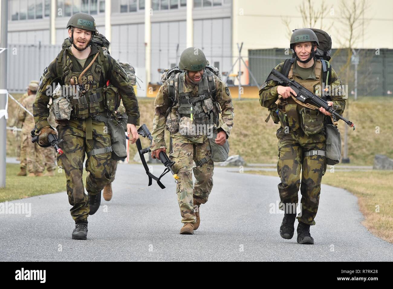 A U. S. Soldier, center, and two soldiers from the Check Republic ...