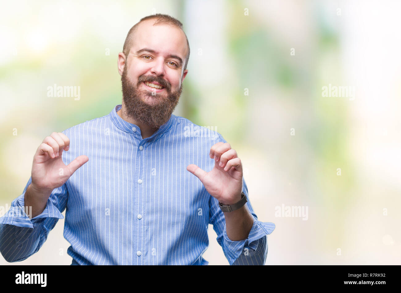Young caucasian hipster man over isolated background looking confident ...