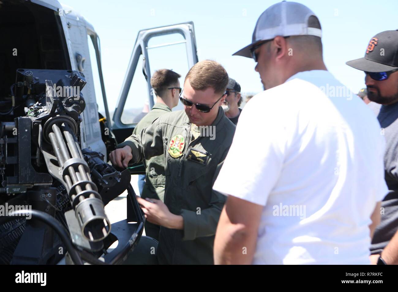 A crew chief with Marine Light Attack Helicopter Squadron (HMLA) 369 ...