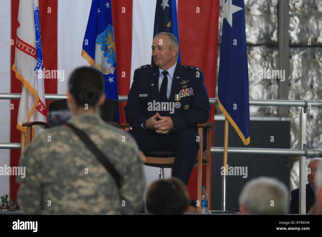 Maj. Gen. H. Michael Edwards listens to a speaker during his retirement ...