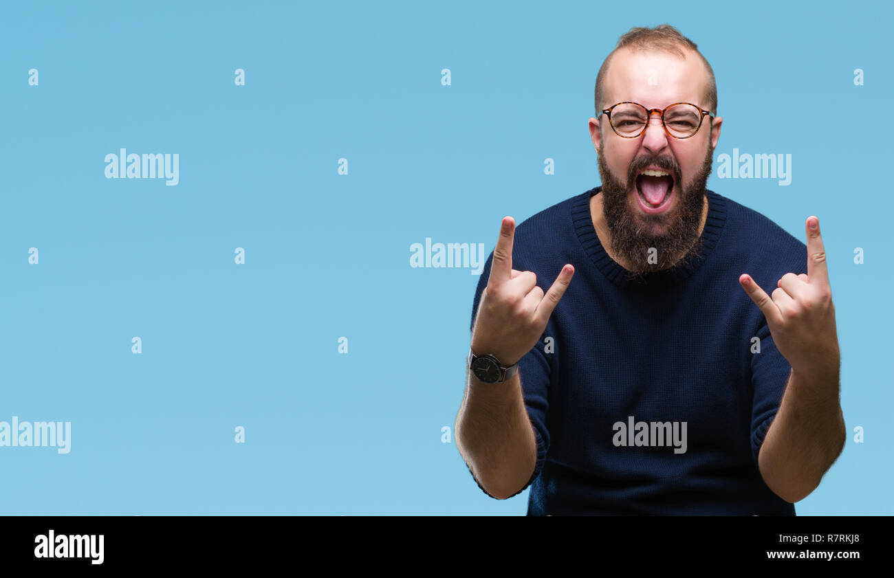 Young caucasian hipster man wearing sunglasses over isolated background ...